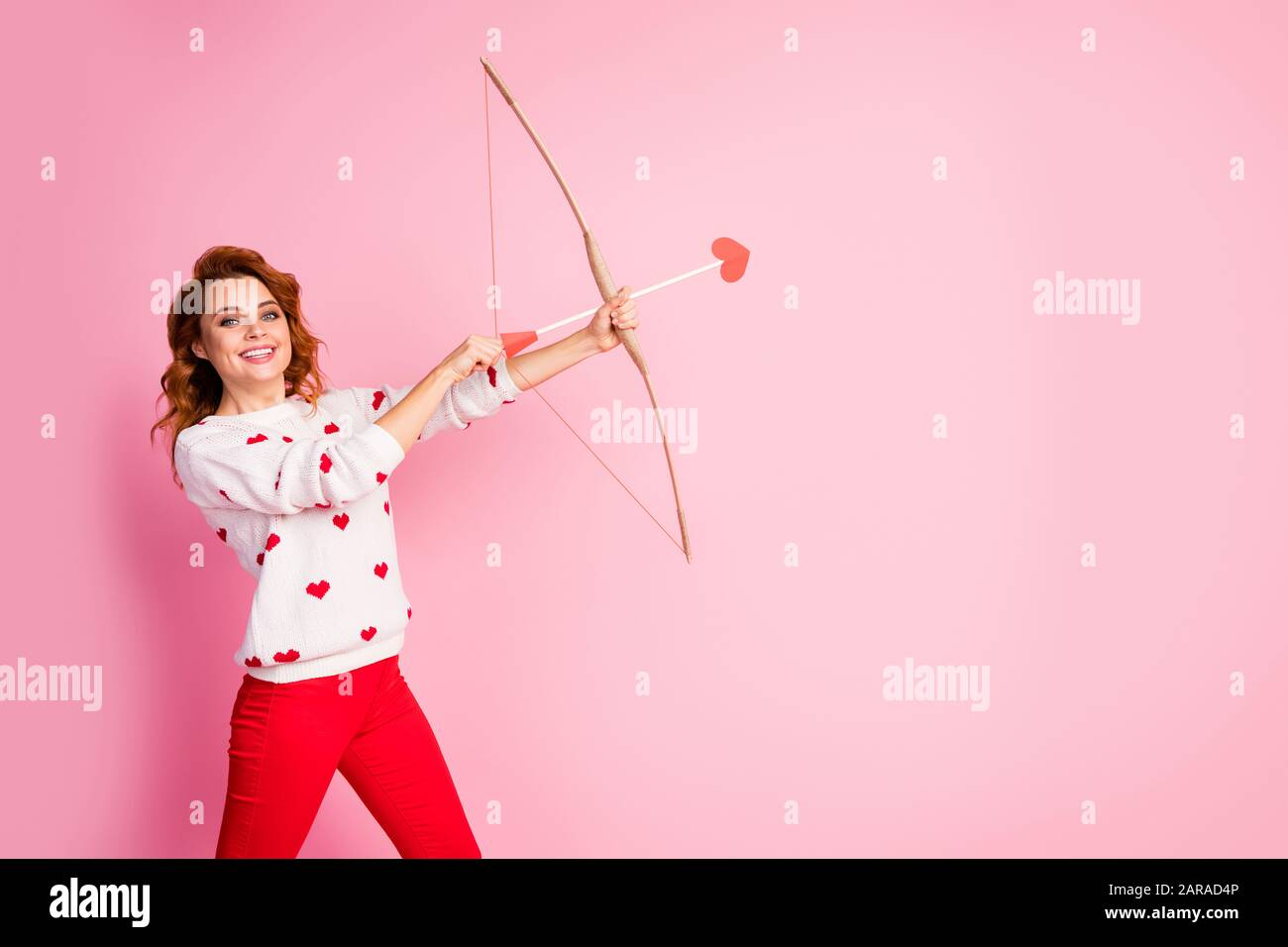 Beautiful woman aiming bow arrow hi-res stock photography and images ...