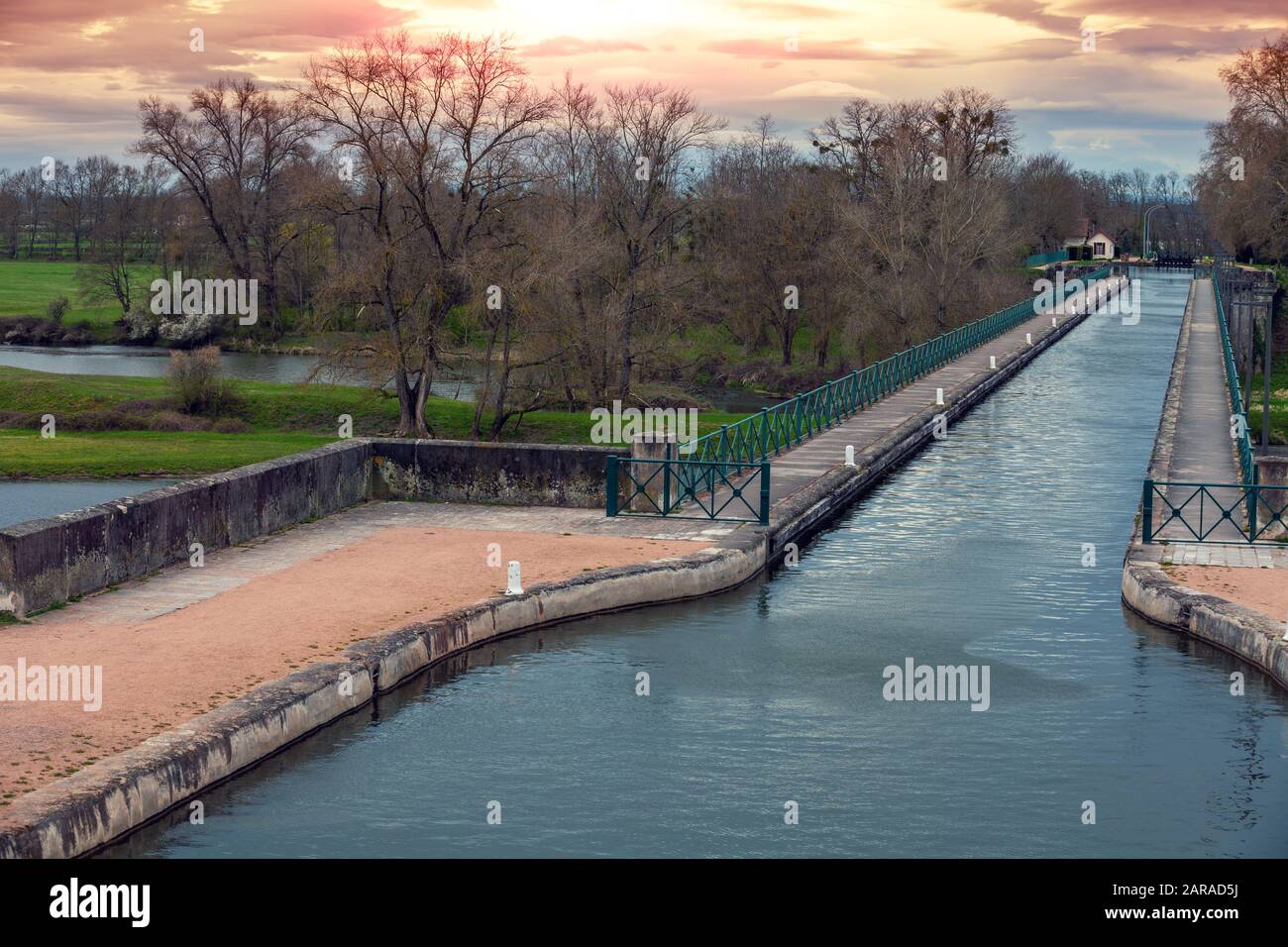 Digoin canal bridge. Boat canal bridge over Laura river in early spring ...