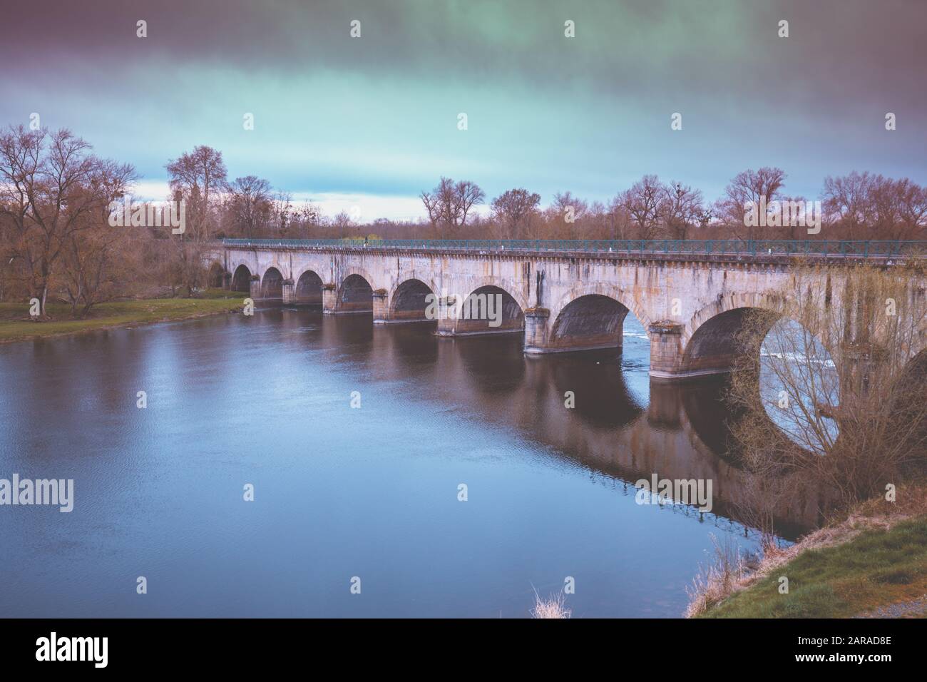 Digoin canal bridge. Boat canal bridge over Laura river in early spring ...