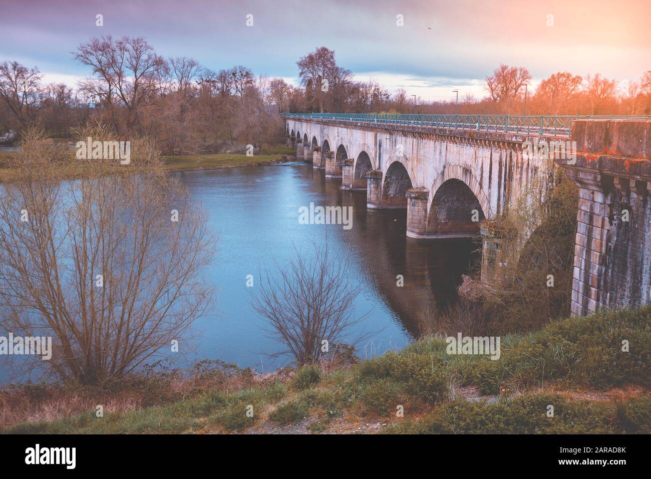 Digoin canal bridge. Boat canal bridge over Laura river in early spring ...