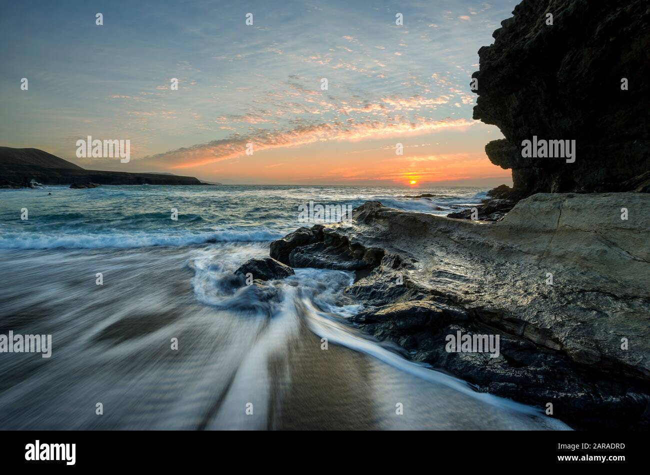 sunset on the rocky coast, Canary Islands - Fuerteventura - Ajuy Stock ...