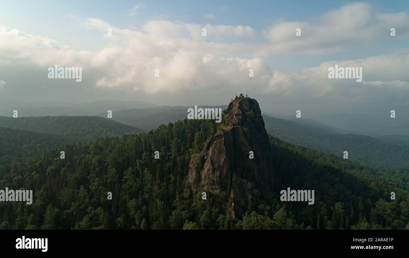 Giant stone pillars from the mountain. Orange morning sun. Cinematic ...