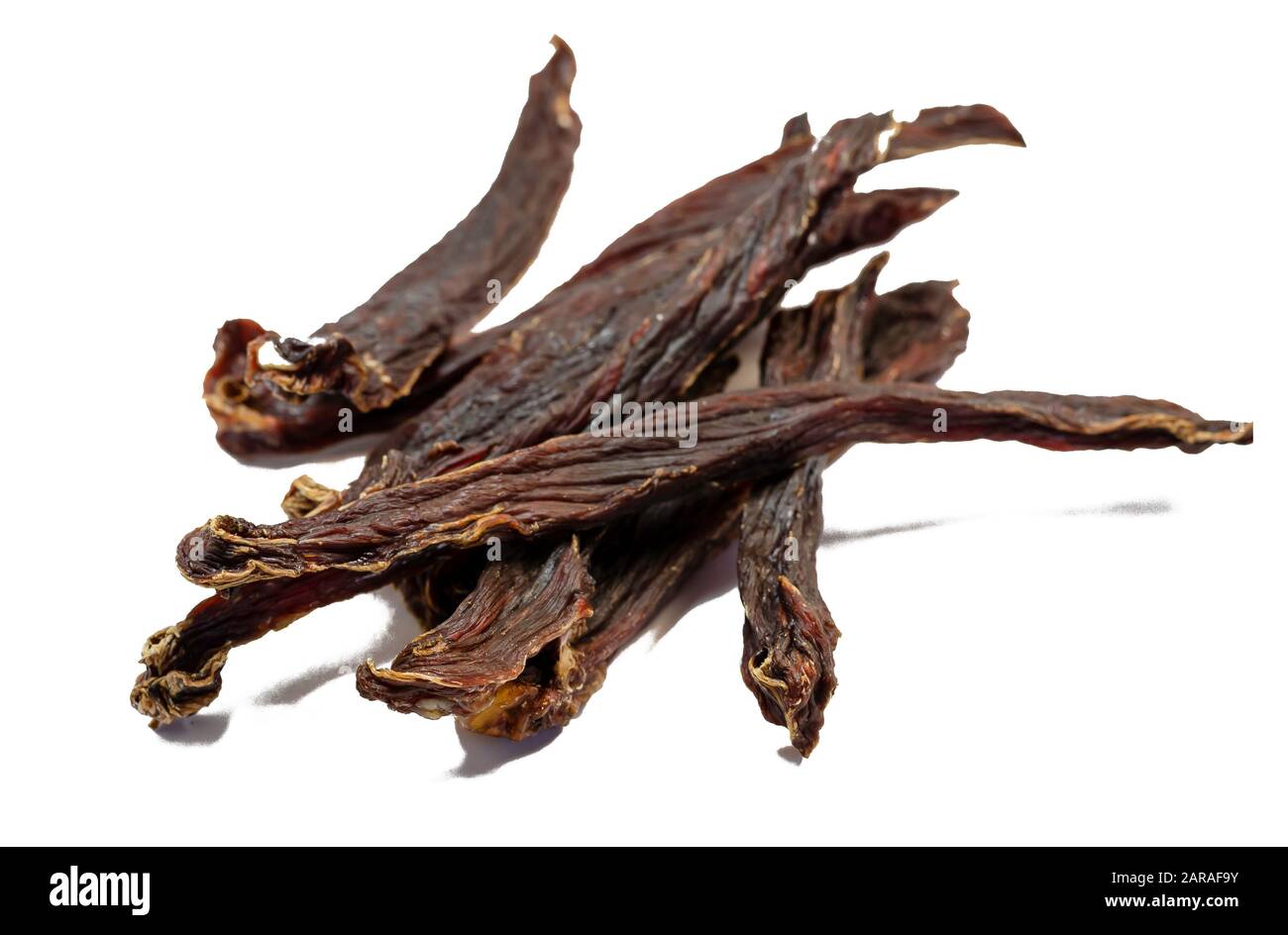 Group of dried beef sticks on a white background. Beer snacks closeup ...