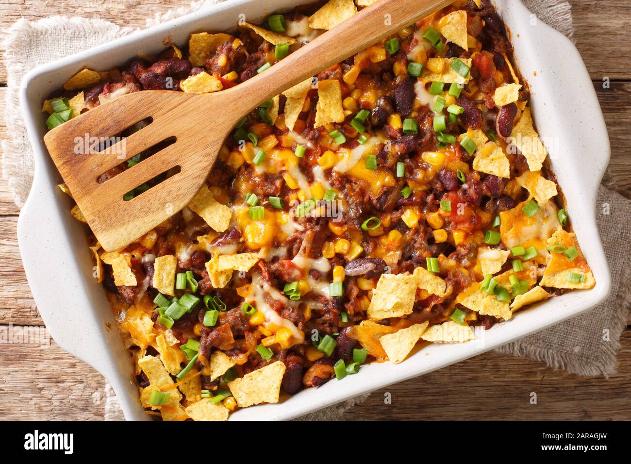 Freshly baked frito pie with ground beef, cheese, corn, beans and chips ...
