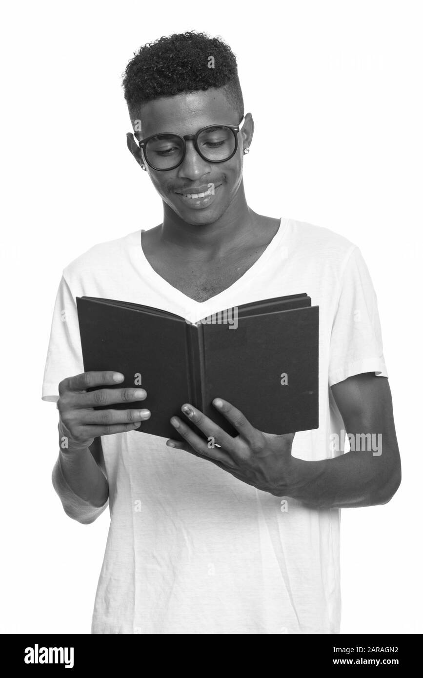Studio shot of young handsome African man with Afro hair isolated ...