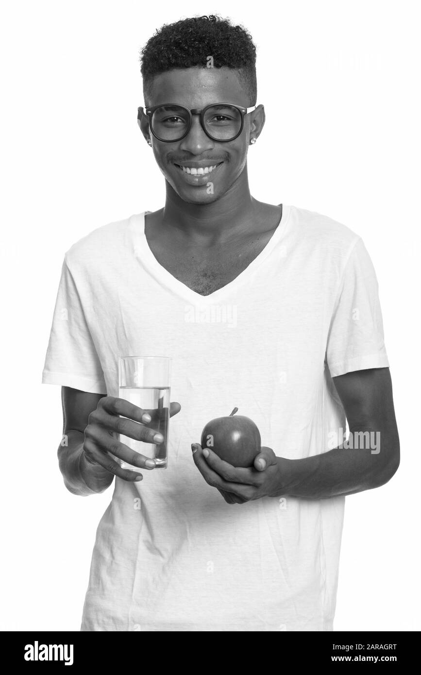 Studio shot of young handsome African man with Afro hair isolated ...