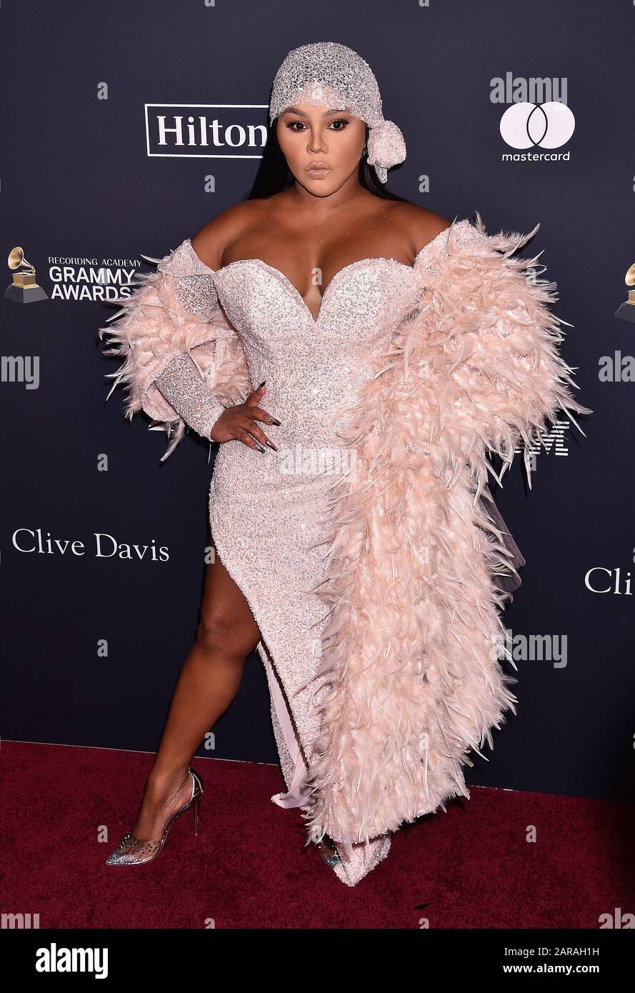 BEVERLY HILLS, CA - JANUARY 25: Lil' Kim attends the Pre-GRAMMY Gala ...
