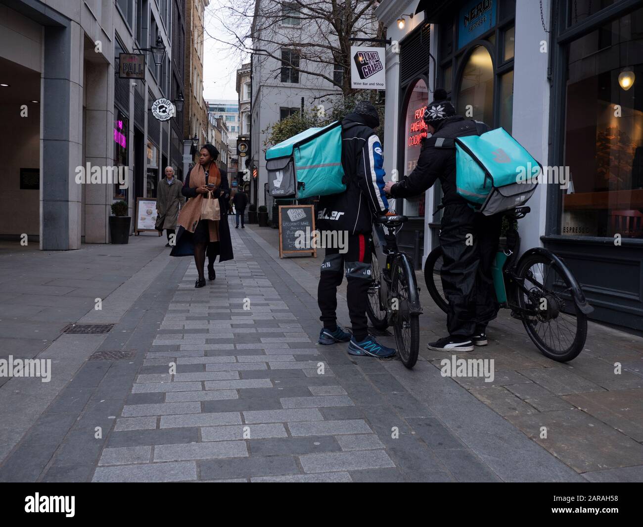 Deliveroo bike delivery riders waiting for food City of London Stock ...
