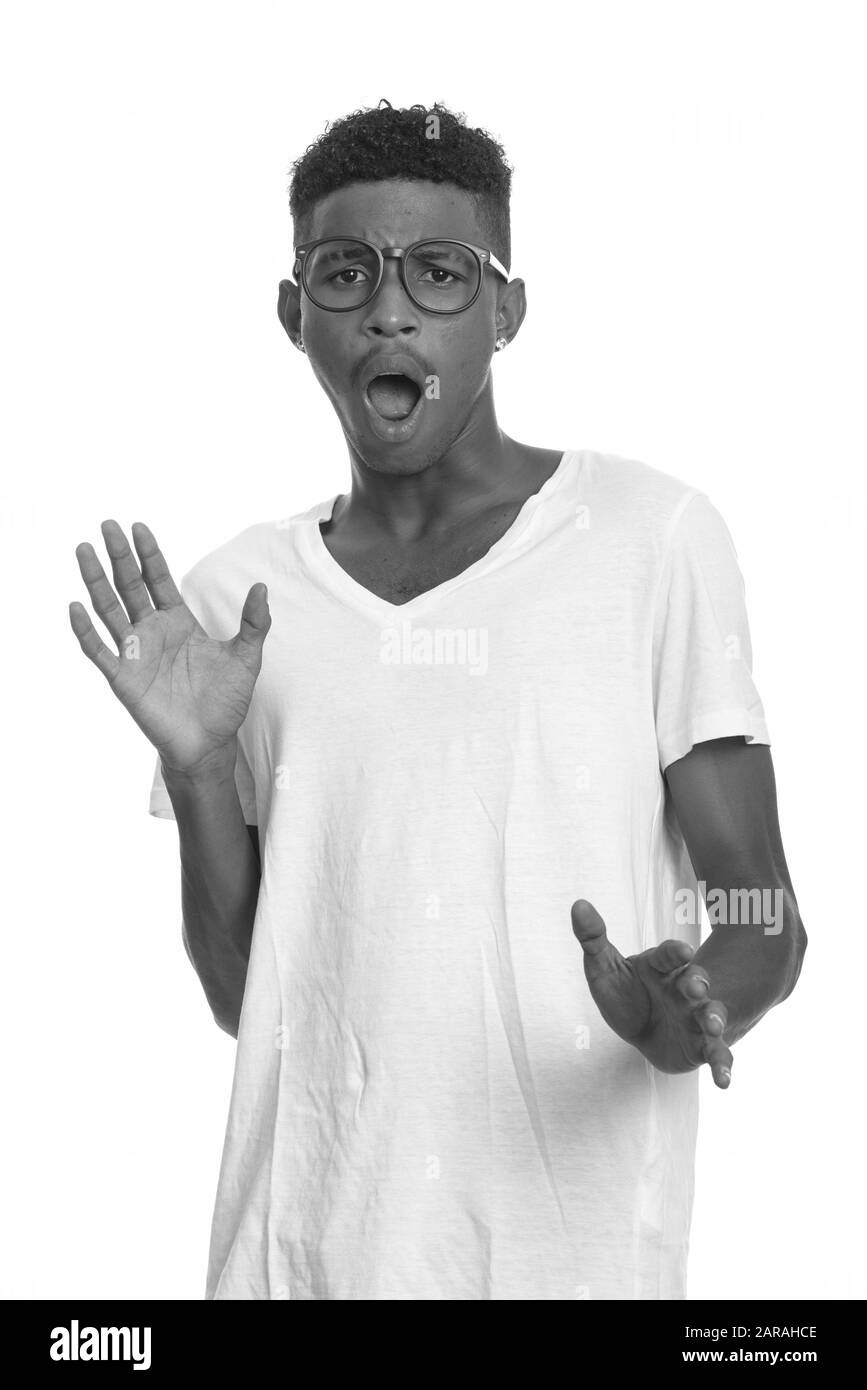 Studio shot of young handsome African man with Afro hair isolated ...