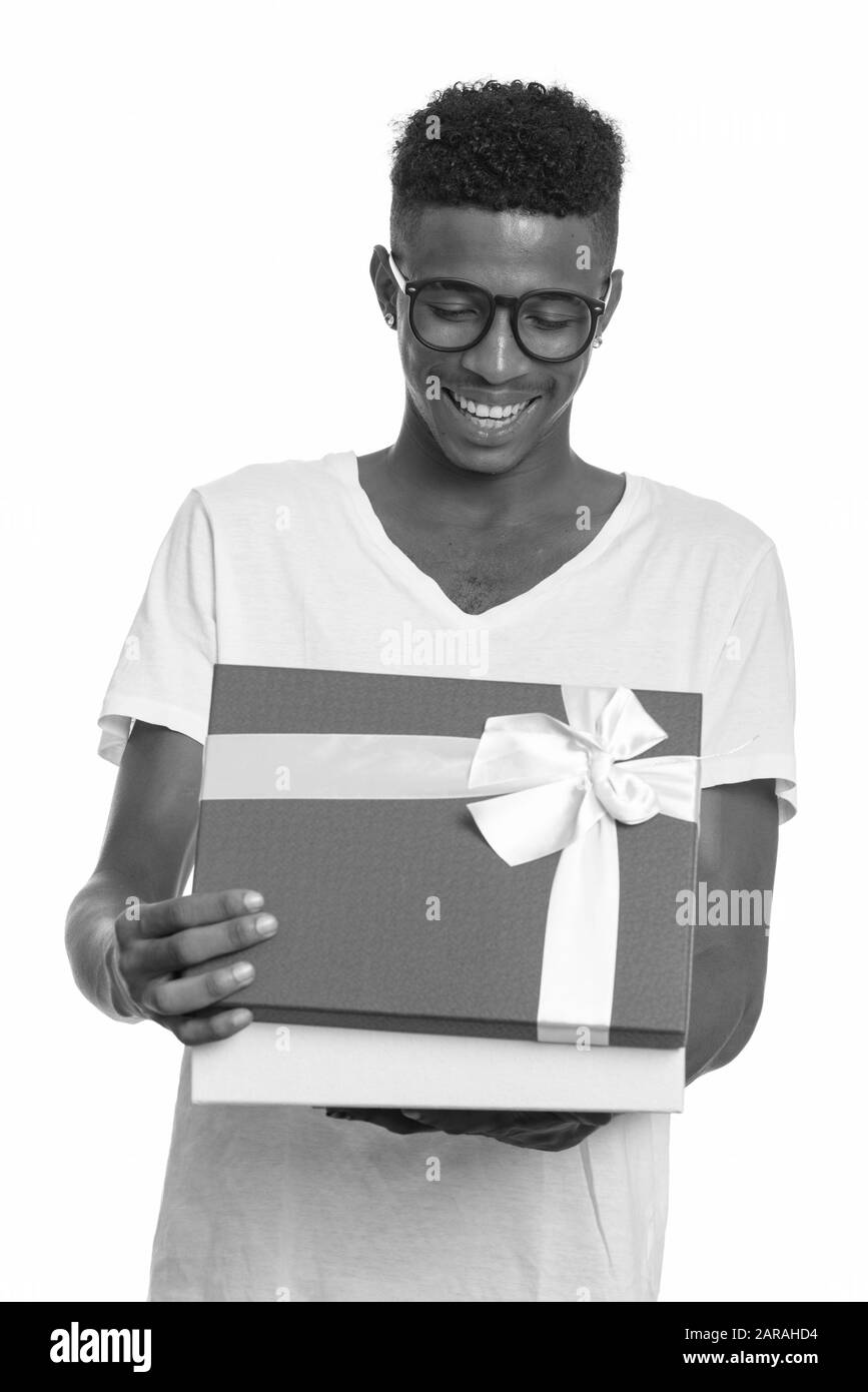 Studio shot of young handsome African man with Afro hair isolated ...