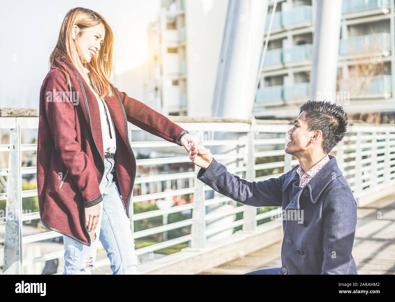 Asian boyfriend holding girlfriend hand for wedding proposal - Man ...