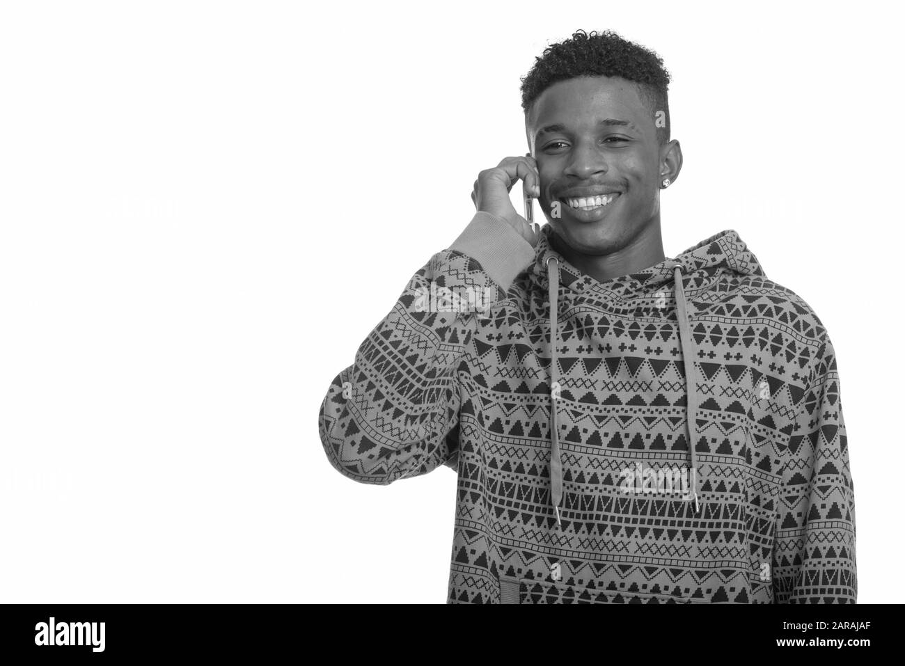 Studio shot of young handsome African man with Afro hair isolated ...