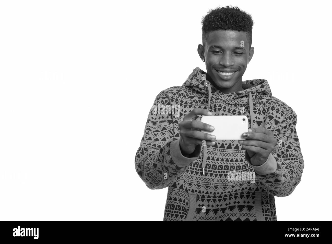 Studio shot of young handsome African man with Afro hair isolated ...