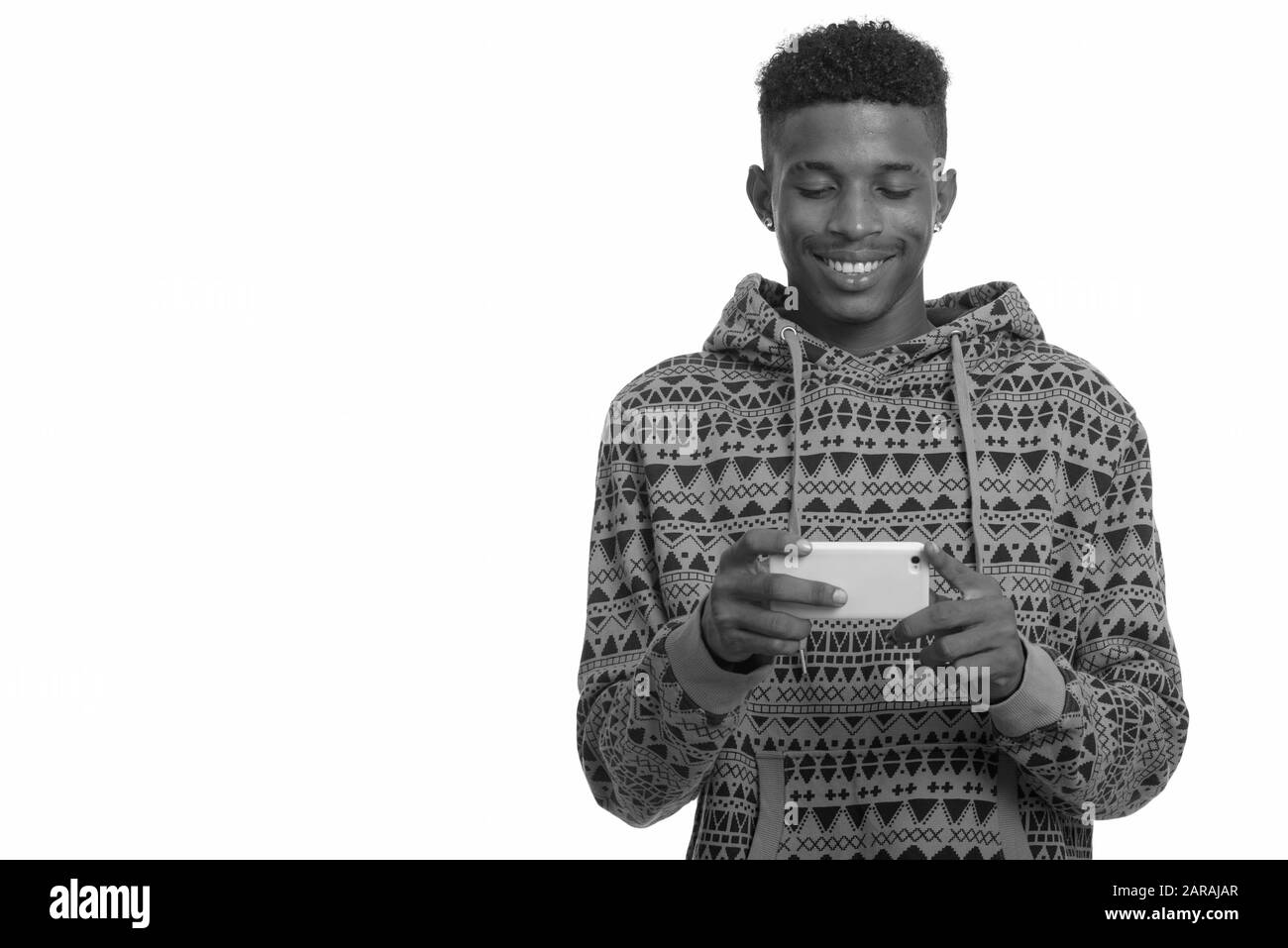 Studio shot of young handsome African man with Afro hair isolated ...