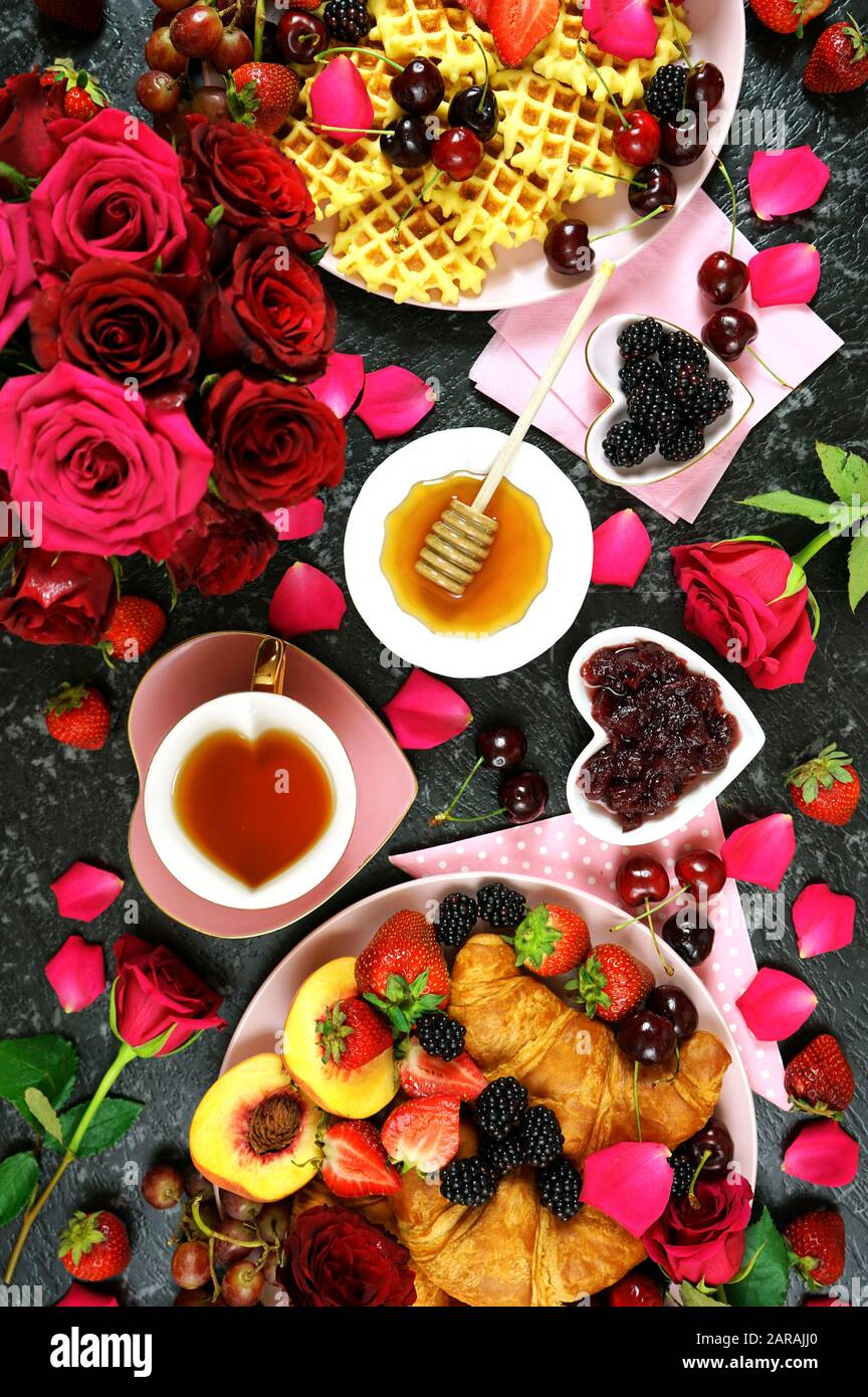 Romantic indulgent breakfast creative layout flat lay with croissants ...