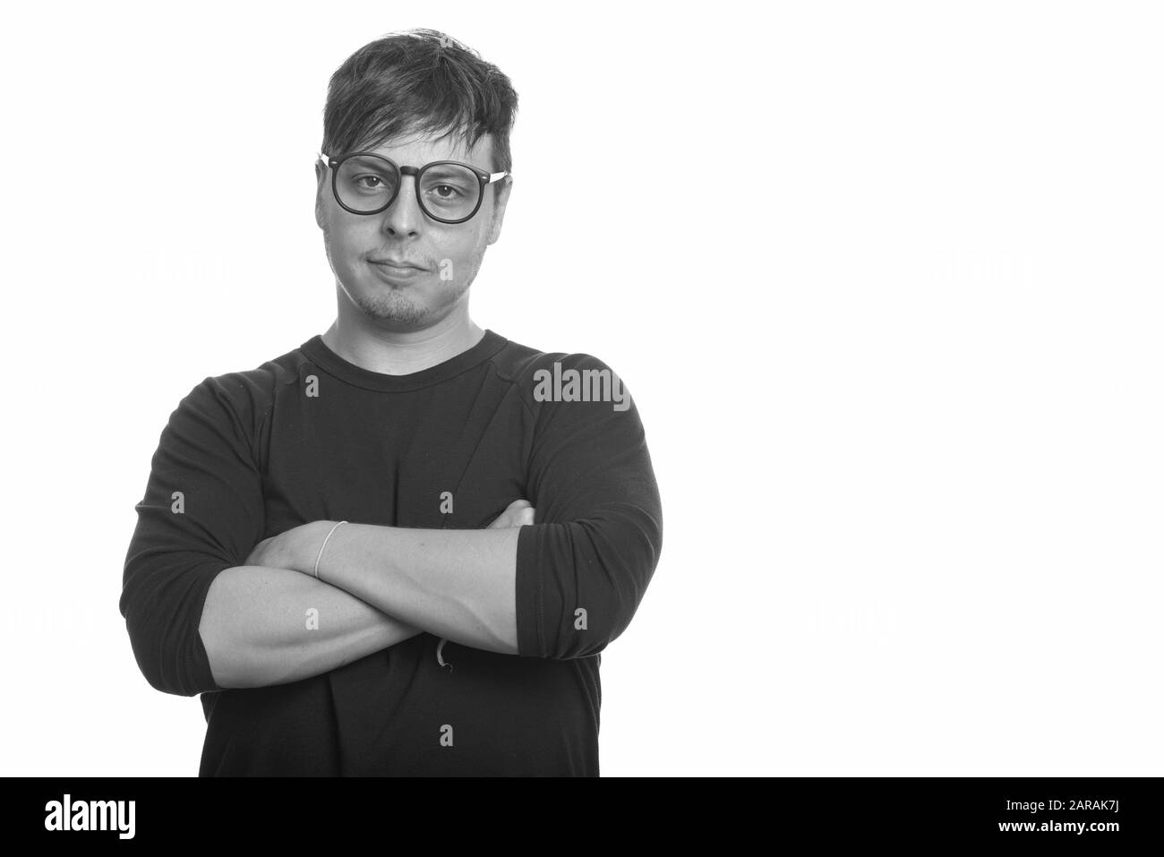 Studio shot of man with beard stubble isolated against white background ...