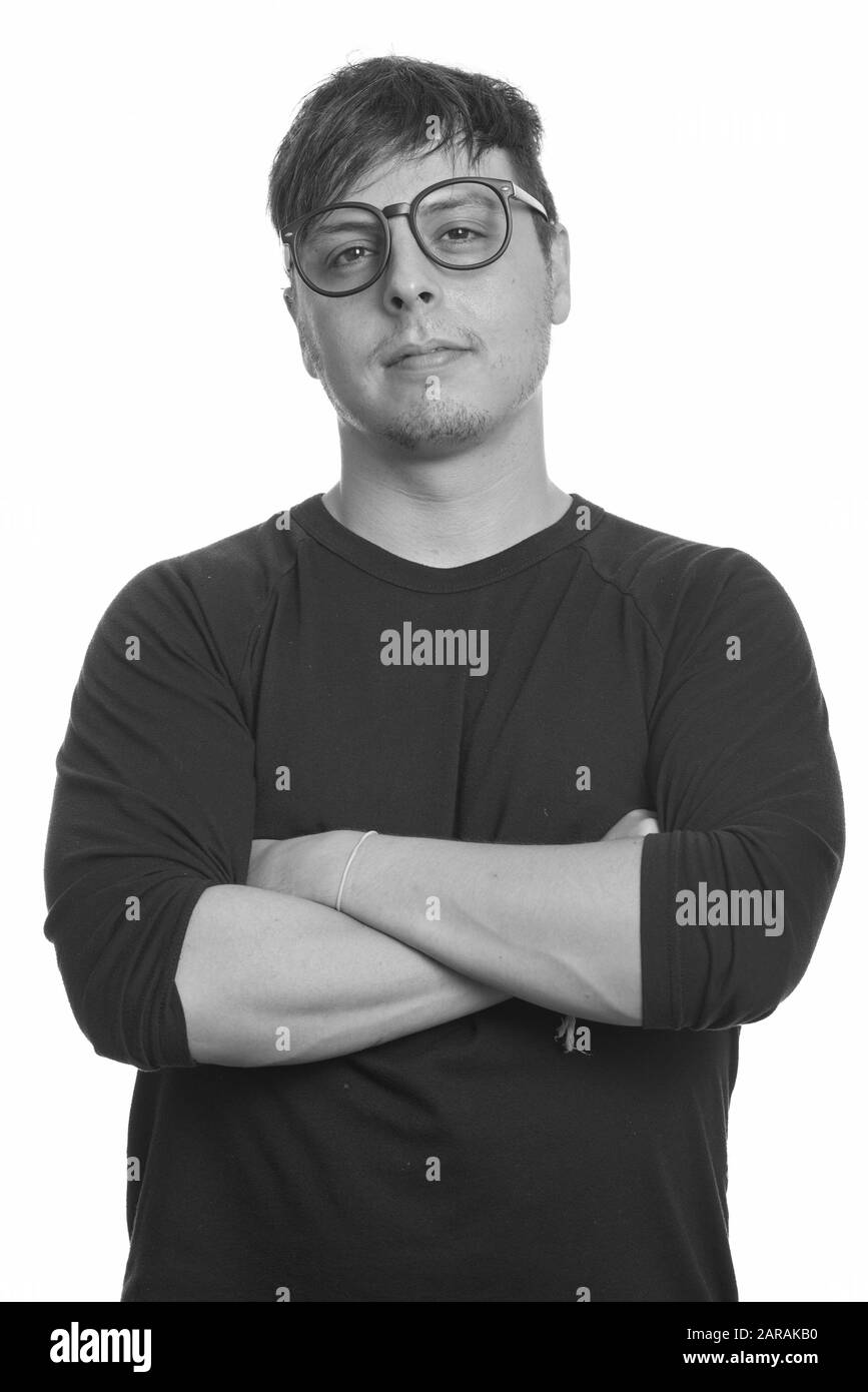 Studio shot of man with beard stubble isolated against white background ...