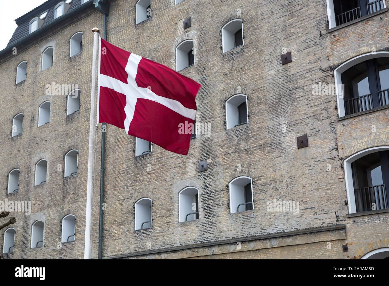 Danish flag waving in the wind outdoors Stock Photo - Alamy