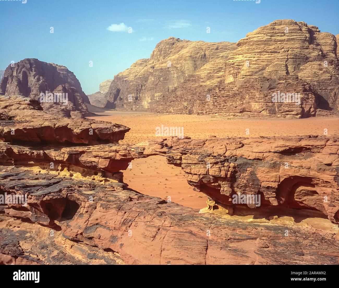 Jordan. Colourful desert mountain landscapes at the rock arch of Al ...