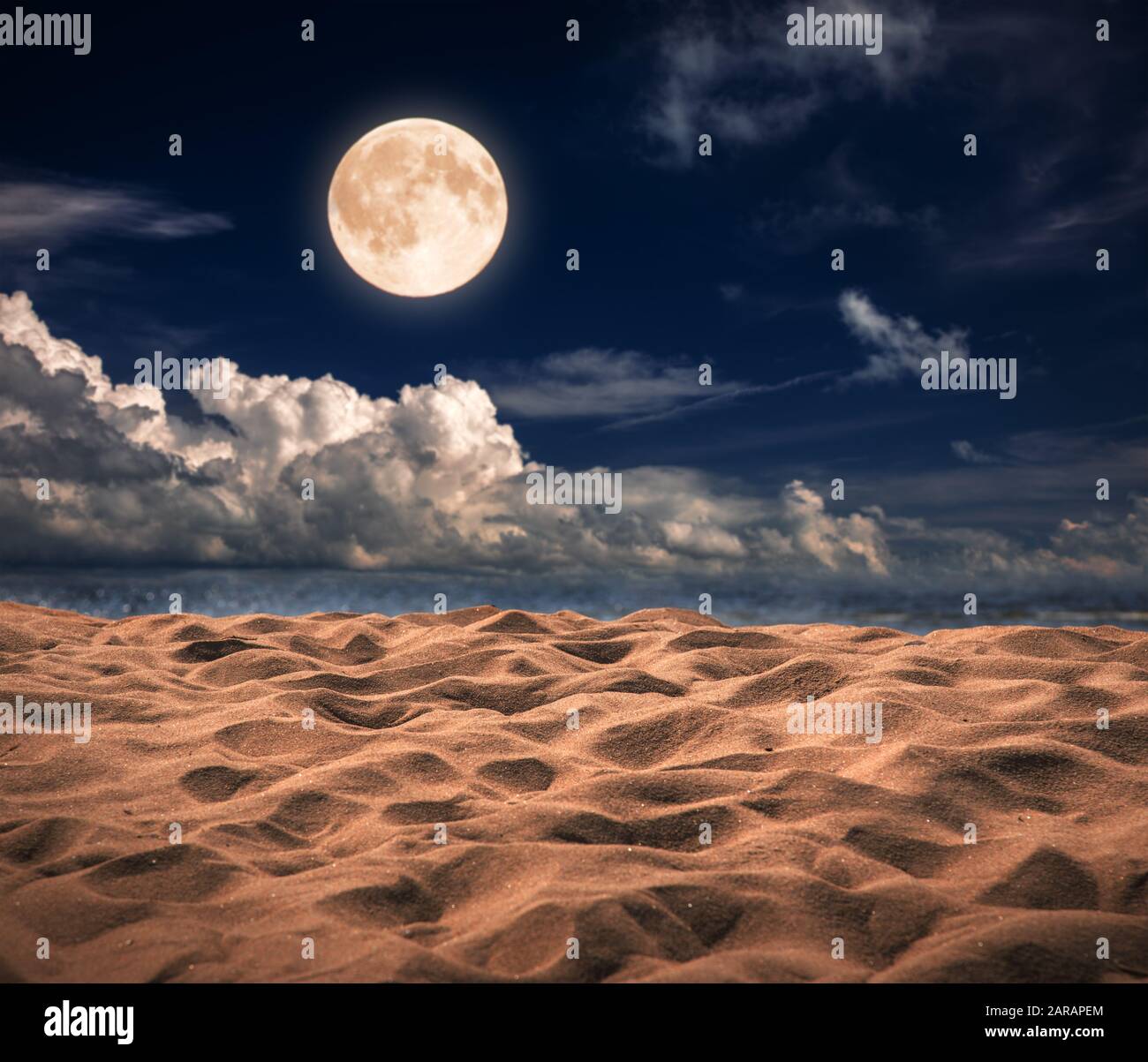 Sandy beach and moon at night Stock Photo - Alamy