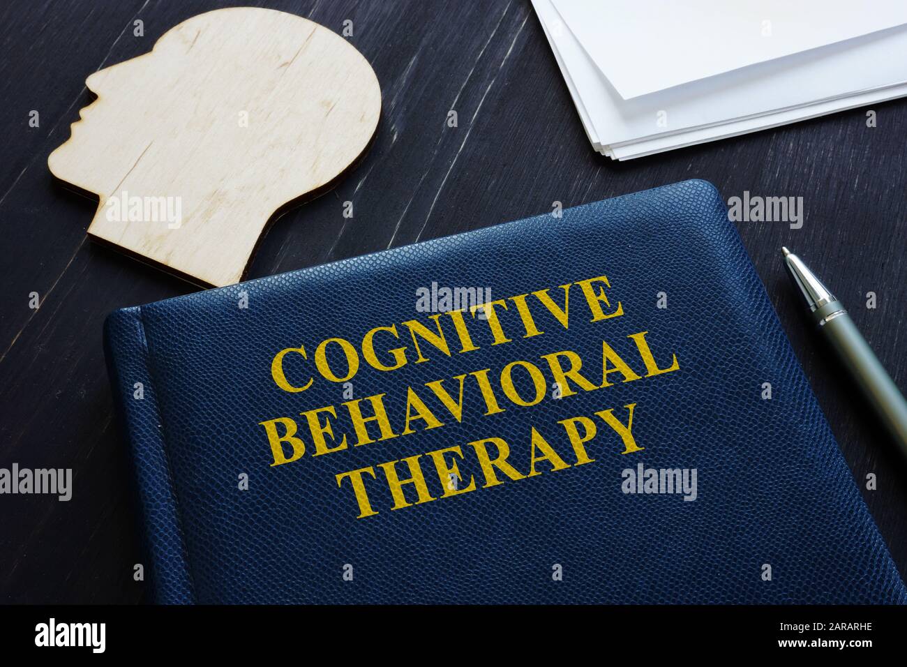 Cognitive behavioral therapy CBT book and wooden head shape Stock Photo ...