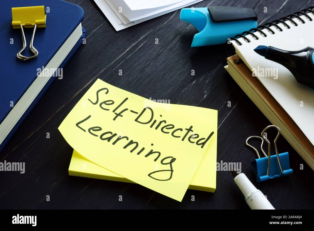 Self-directed learning or education concept. Book and notes with pen ...