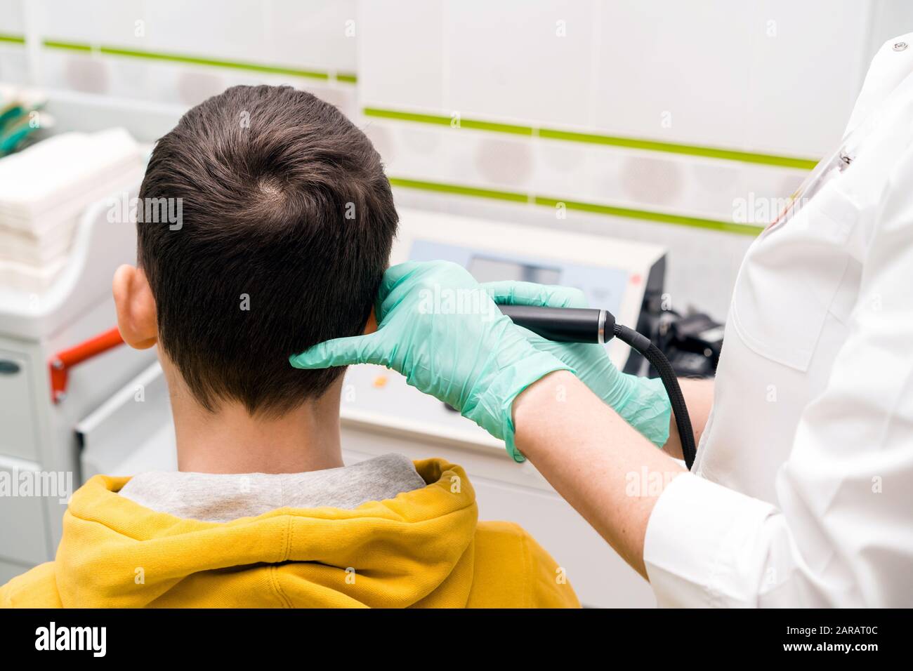 Preventive examination of a teenage boy in a medical facility Stock ...