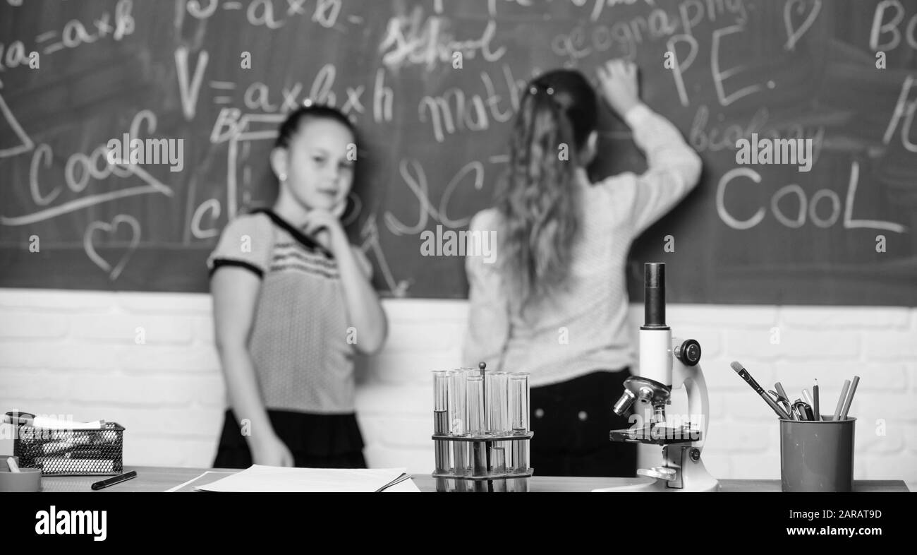 Biology lesson. Back to school. Little scientist work with microscope ...