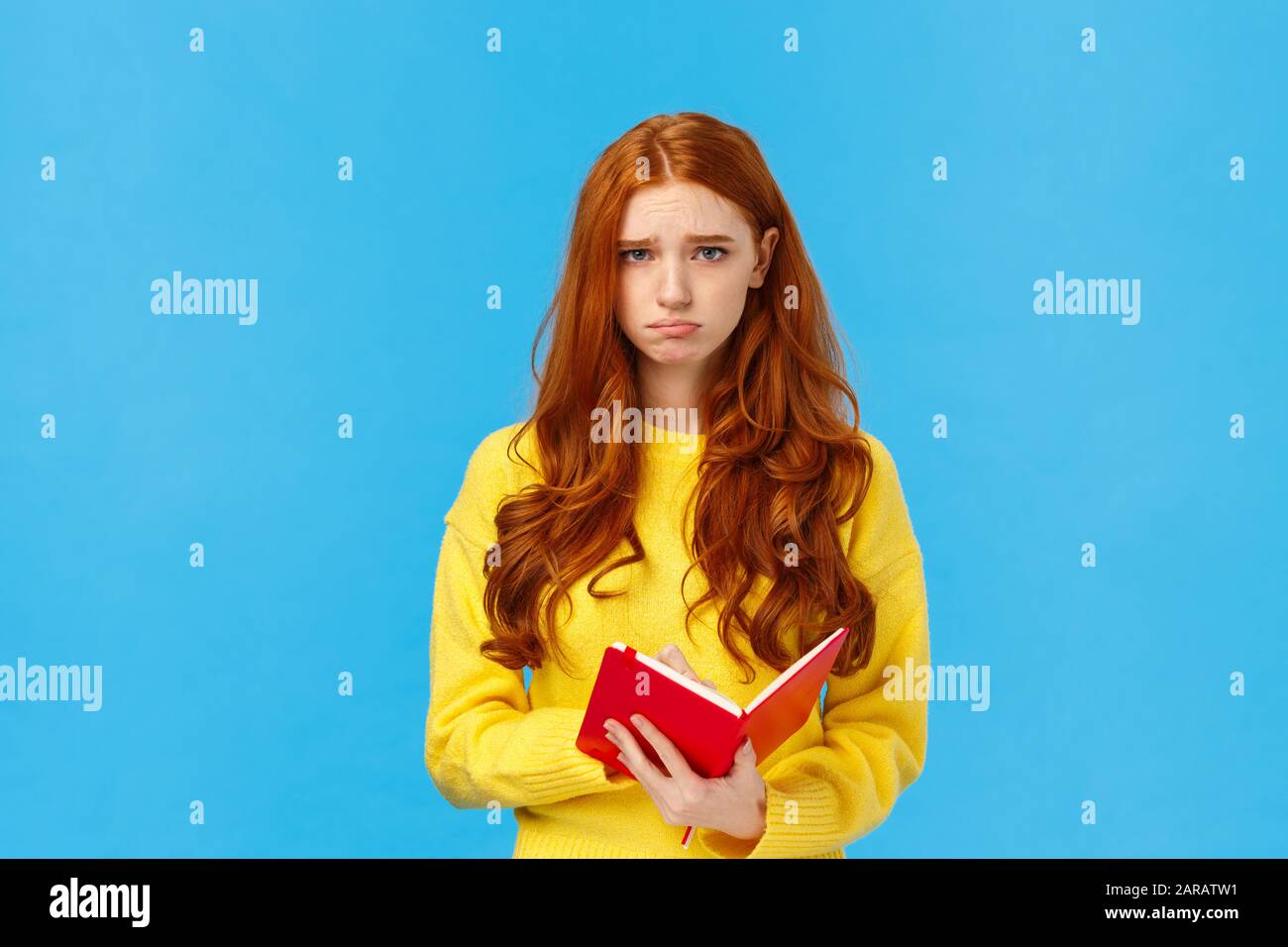 Girl in white sweater writing hi-res stock photography and images - Alamy