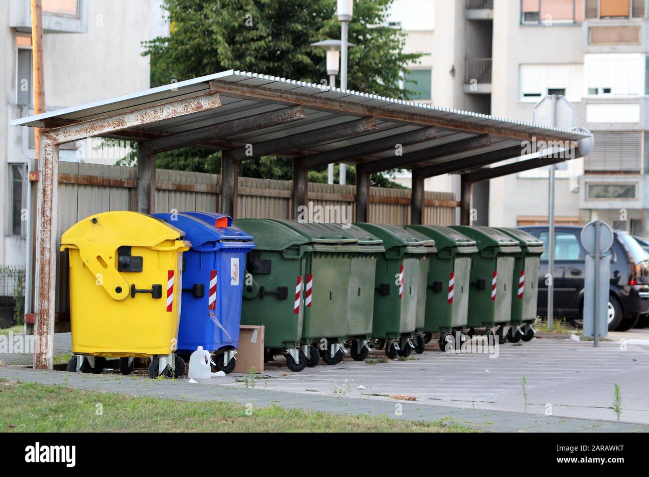 Row of various large plastic trash containers for ecologically sorting ...
