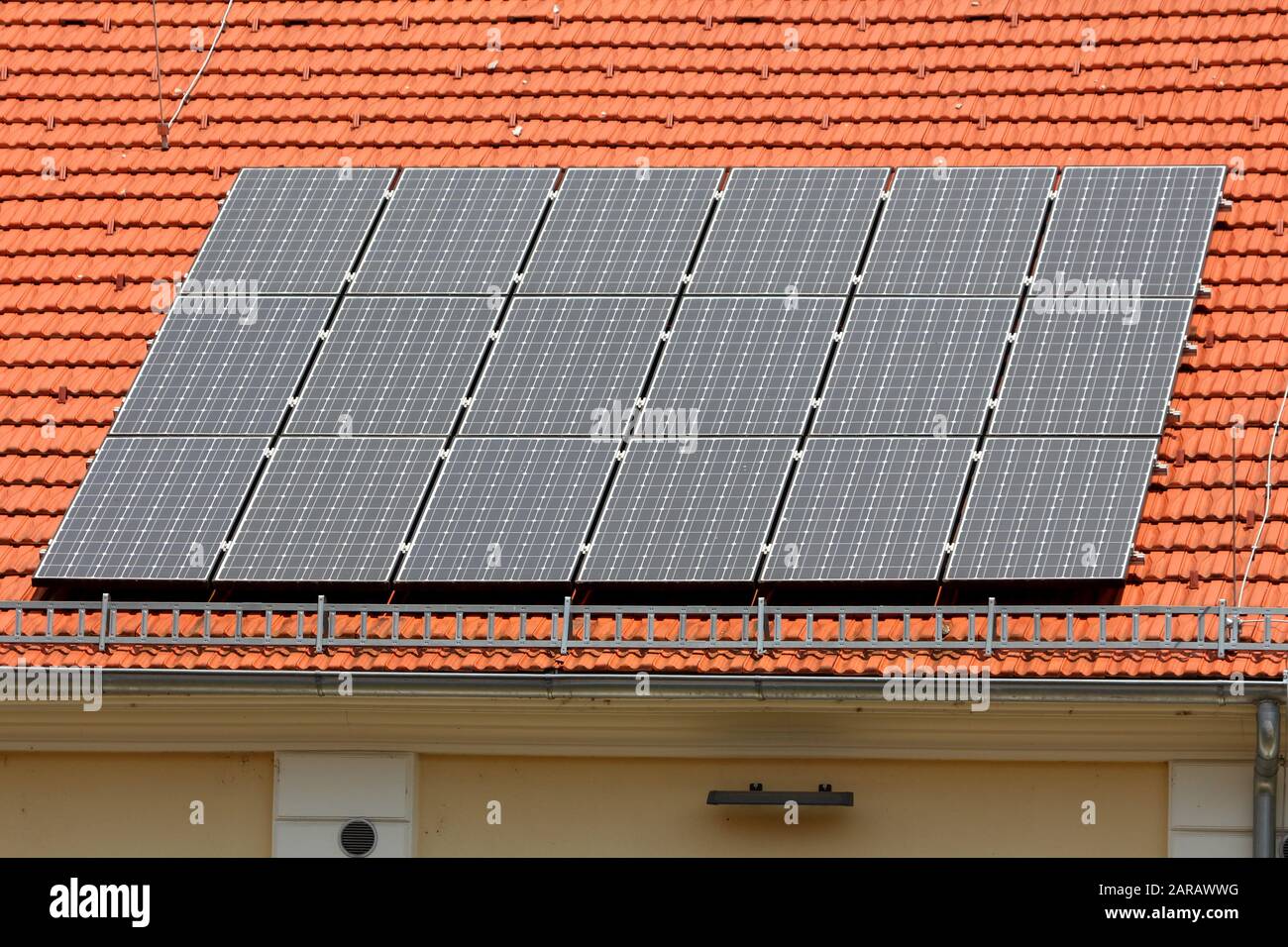 Side view of cluster of eighteen brand new solar panels mounted on top ...