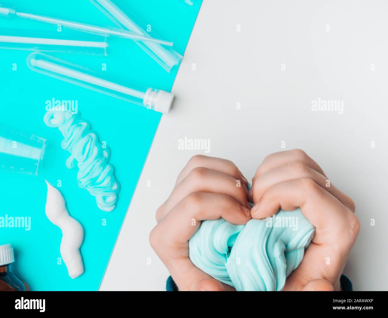 baby holding in hand blue slime and playing, children hobby, child ...