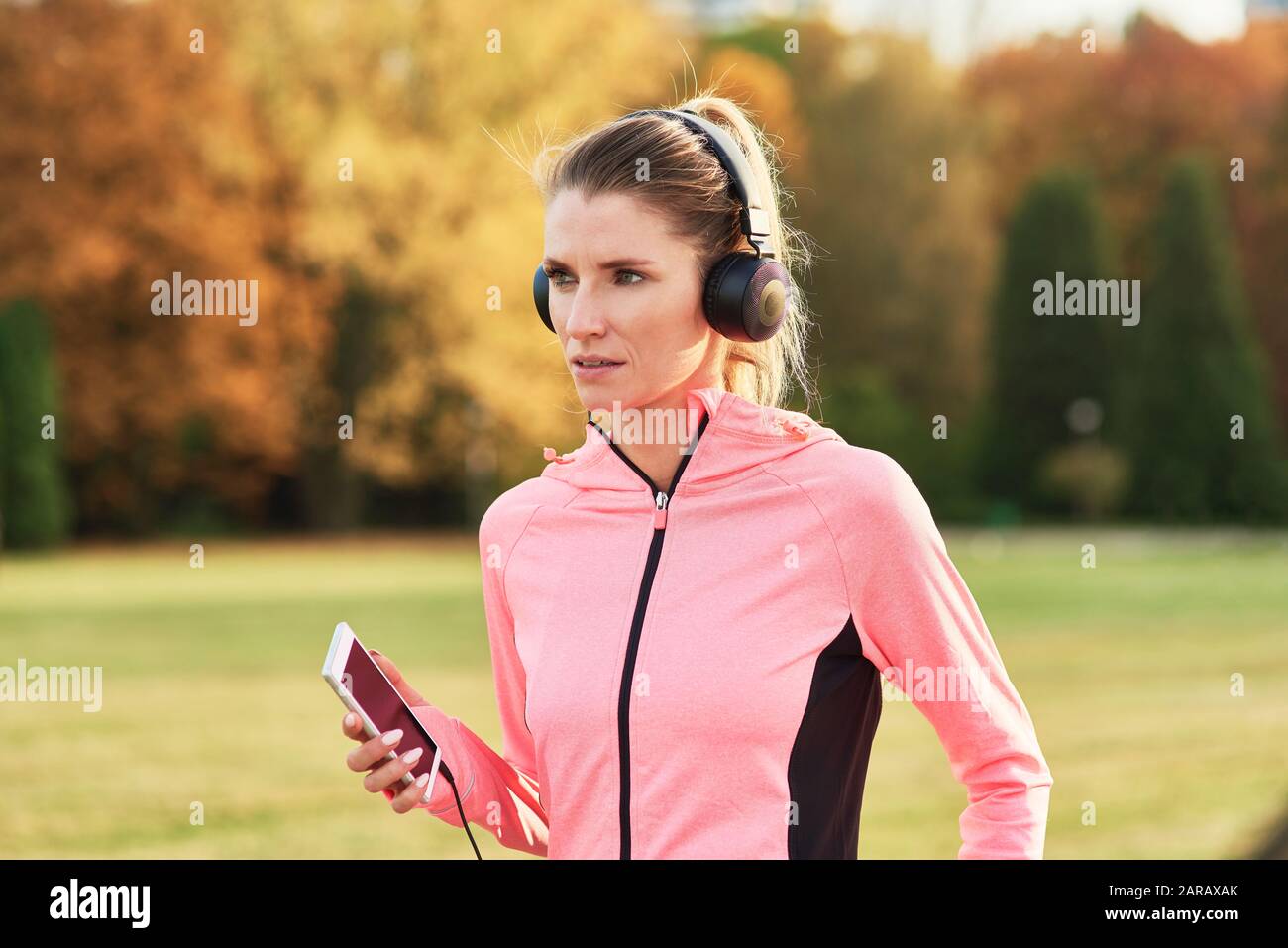Young woman running early in the morning Stock Photo - Alamy