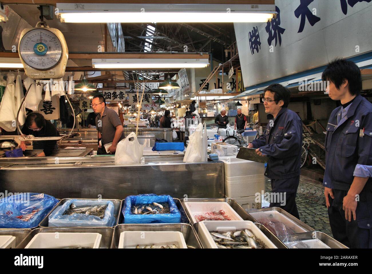 TOKYO, JAPAN - MAY 11, 2012: Merchants sell seafood at Tsukiji Fish ...