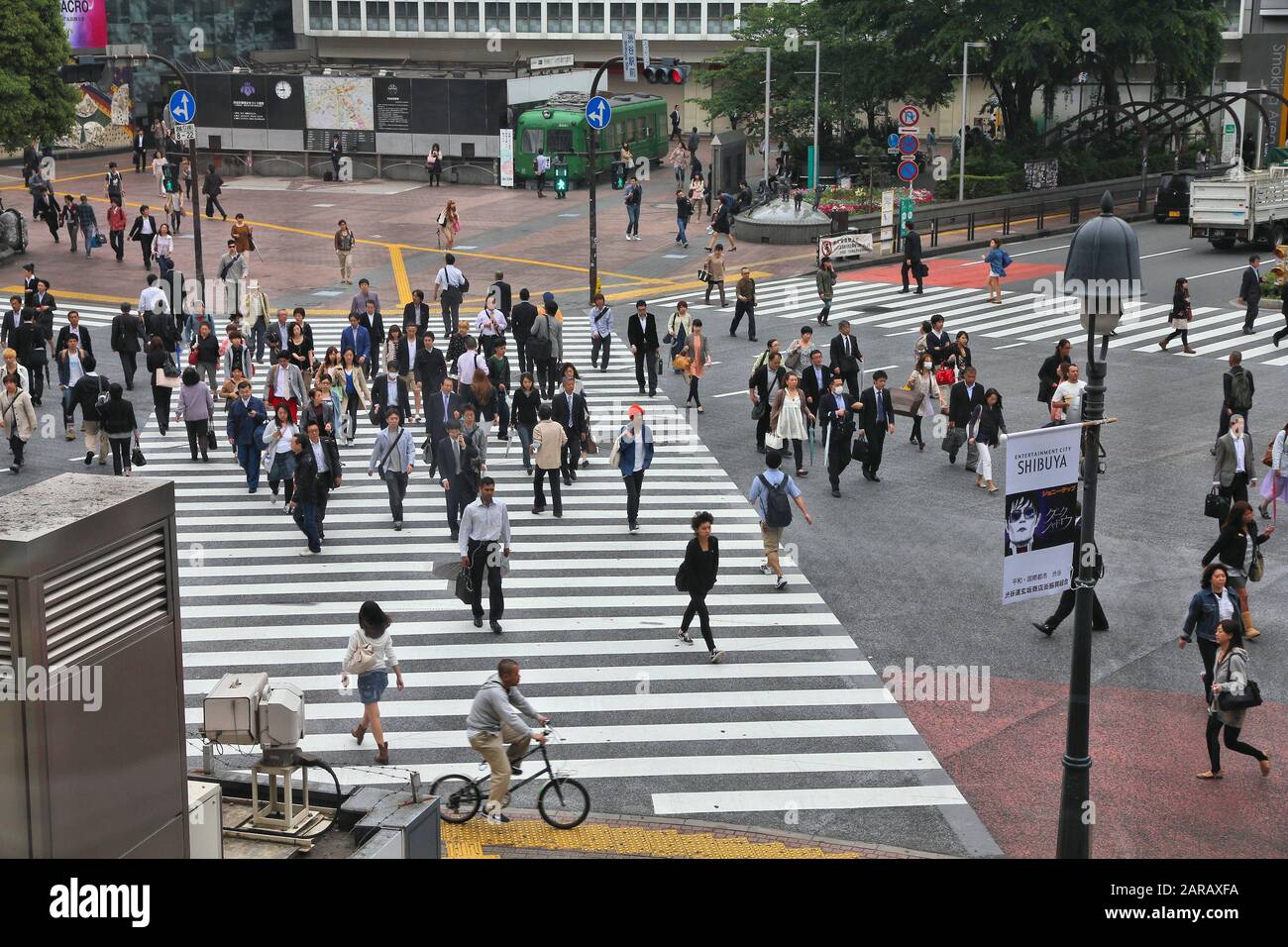 TOKYO, JAPAN - MAY 9, 2012: People walk the Hachiko crossing in Shibuya ...