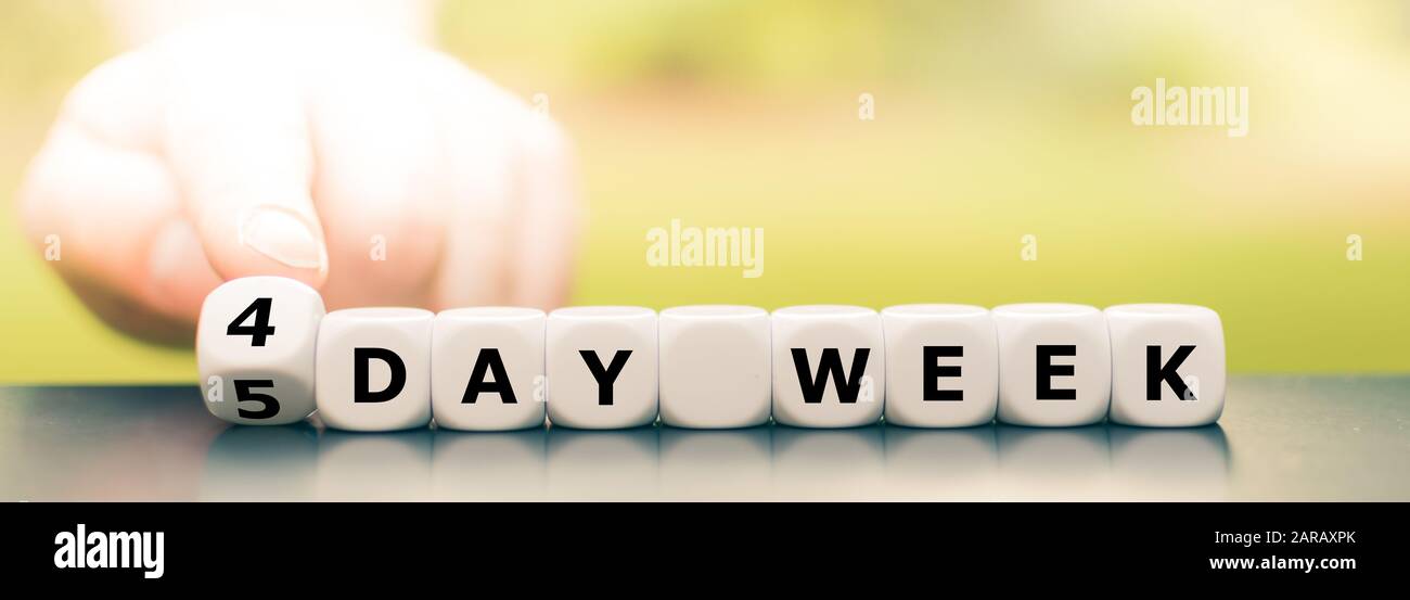 Hand turns a dice and changes the expression "5 day week" to "4 day ...