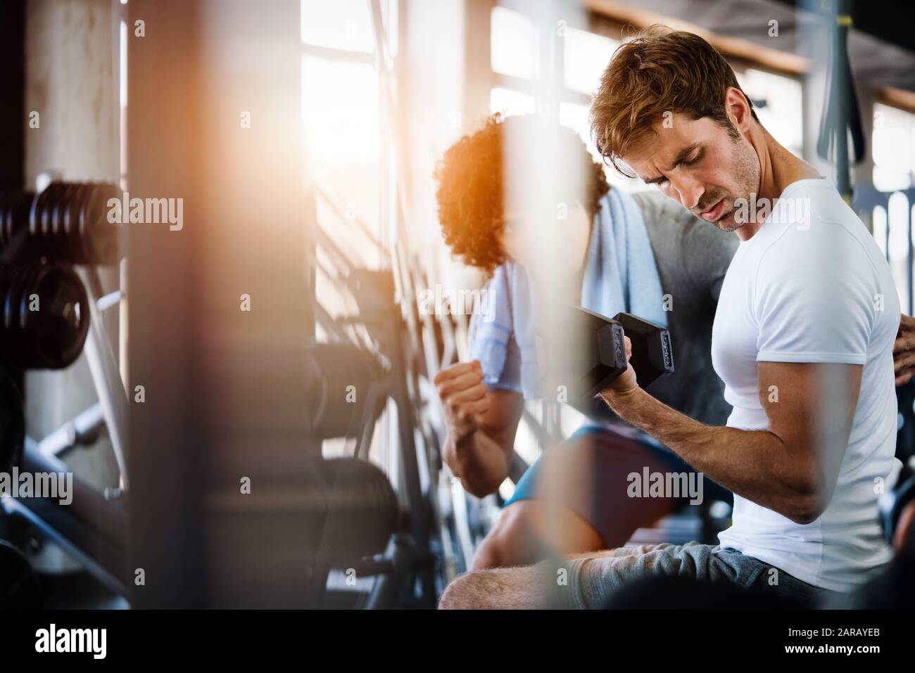 Man in gym with trainer hi-res stock photography and images - Alamy