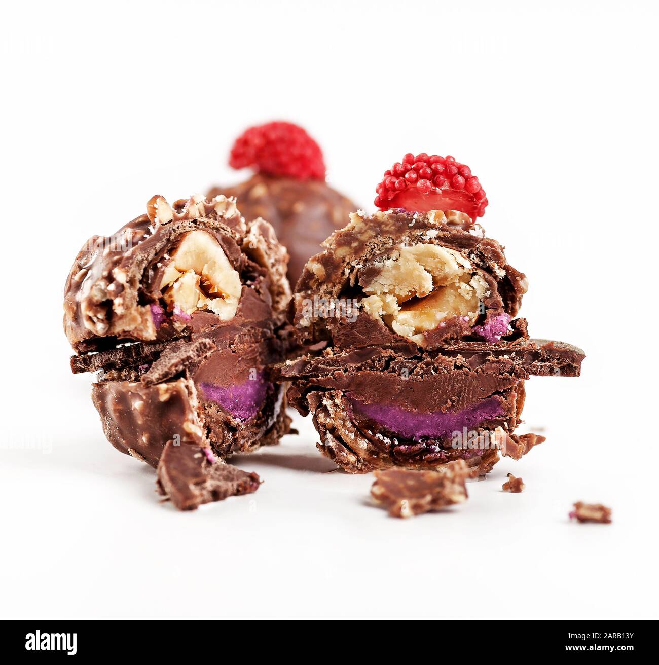 Cut chocolate candy on white background Stock Photo - Alamy