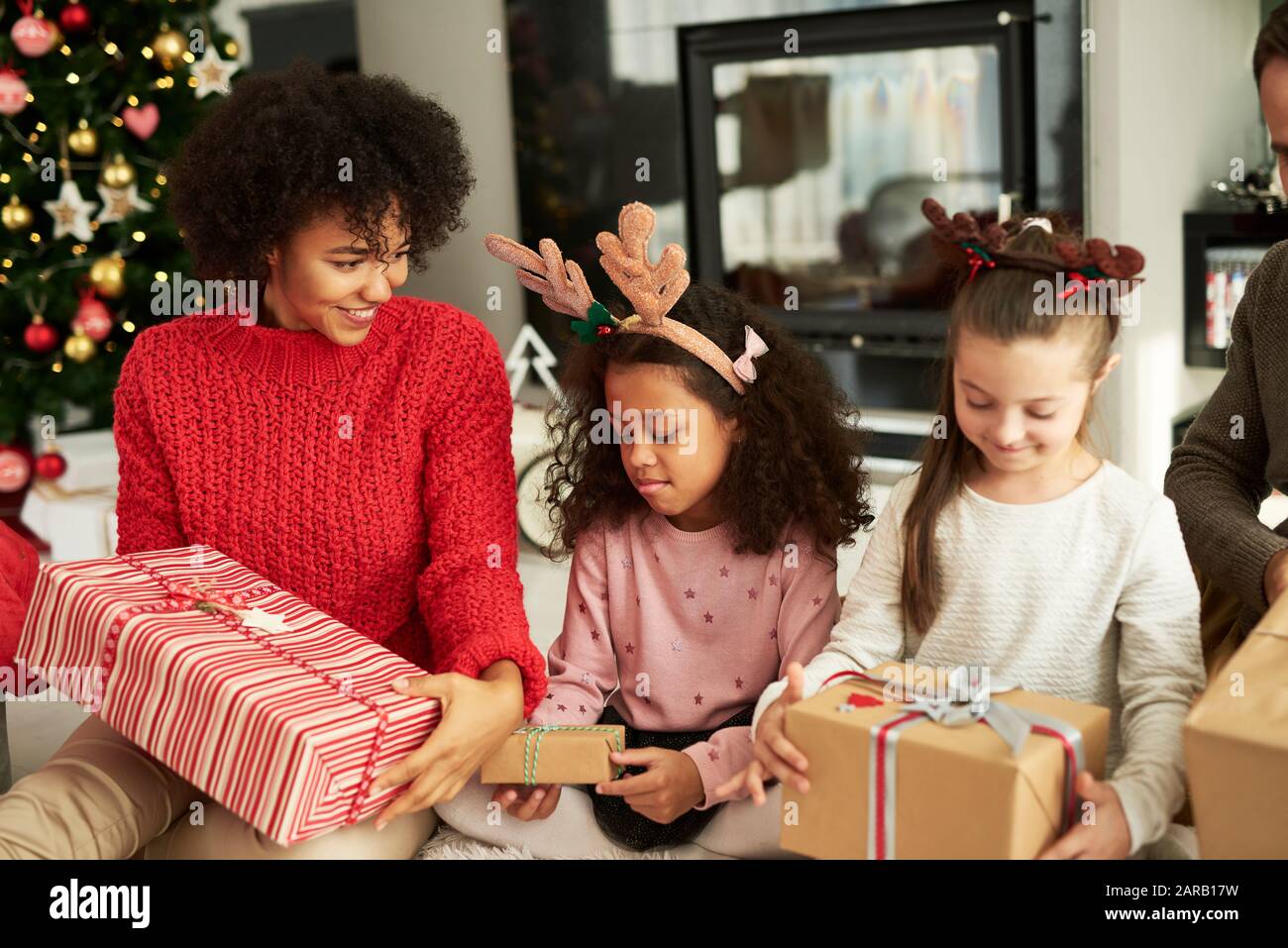 Happy family during the Christmas time Stock Photo - Alamy