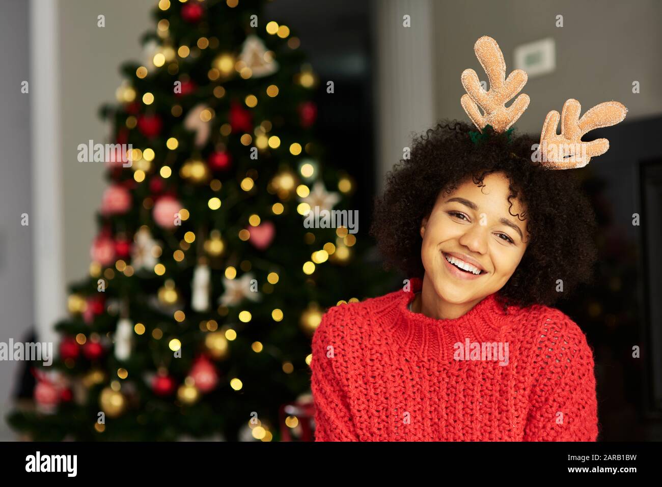 Young smiling family christmas tree hi-res stock photography and images ...