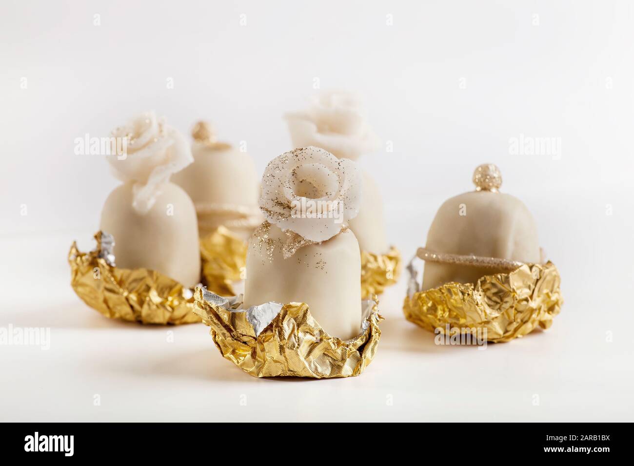 Marzipan sweets on white background Stock Photo - Alamy