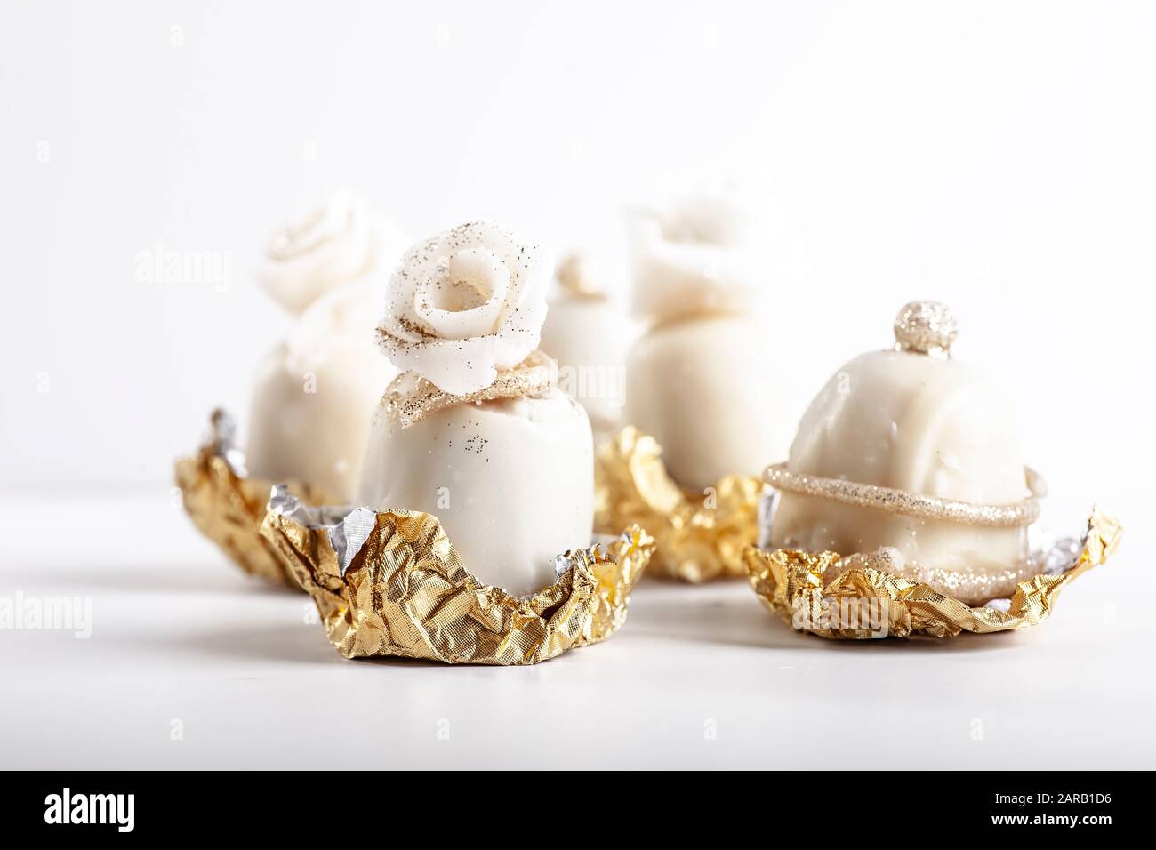 Marzipan sweets on white background Stock Photo - Alamy