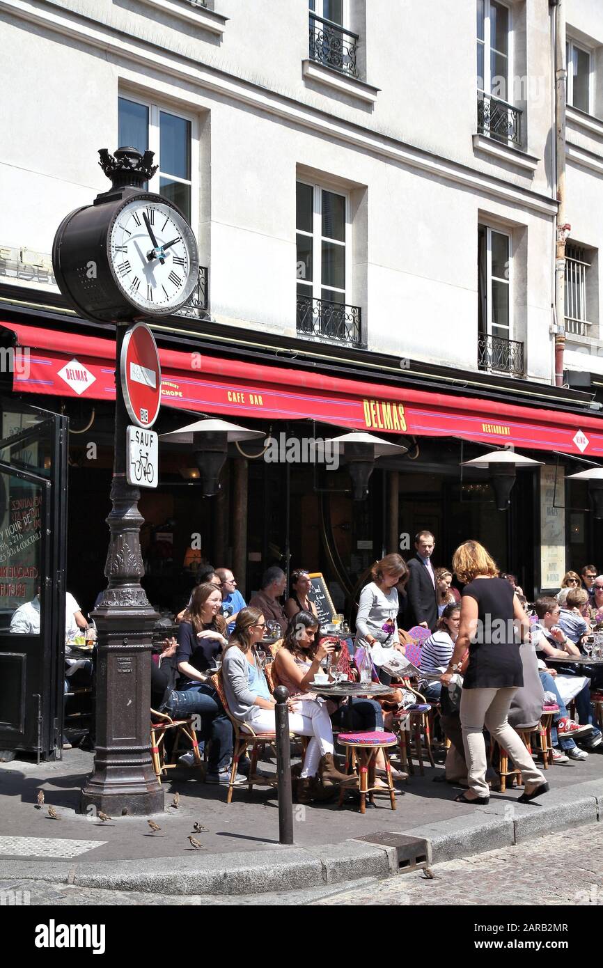 PARIS, FRANCE - JULY 24, 2011: People visit Cafe Delmas in Paris ...