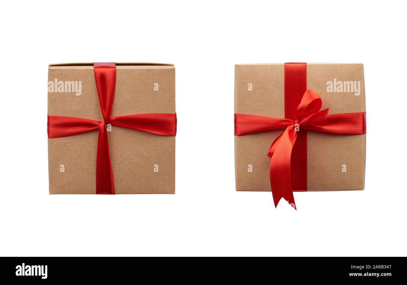 square box wrapped in brown kraft paper and tied with a silk red ribbon ...