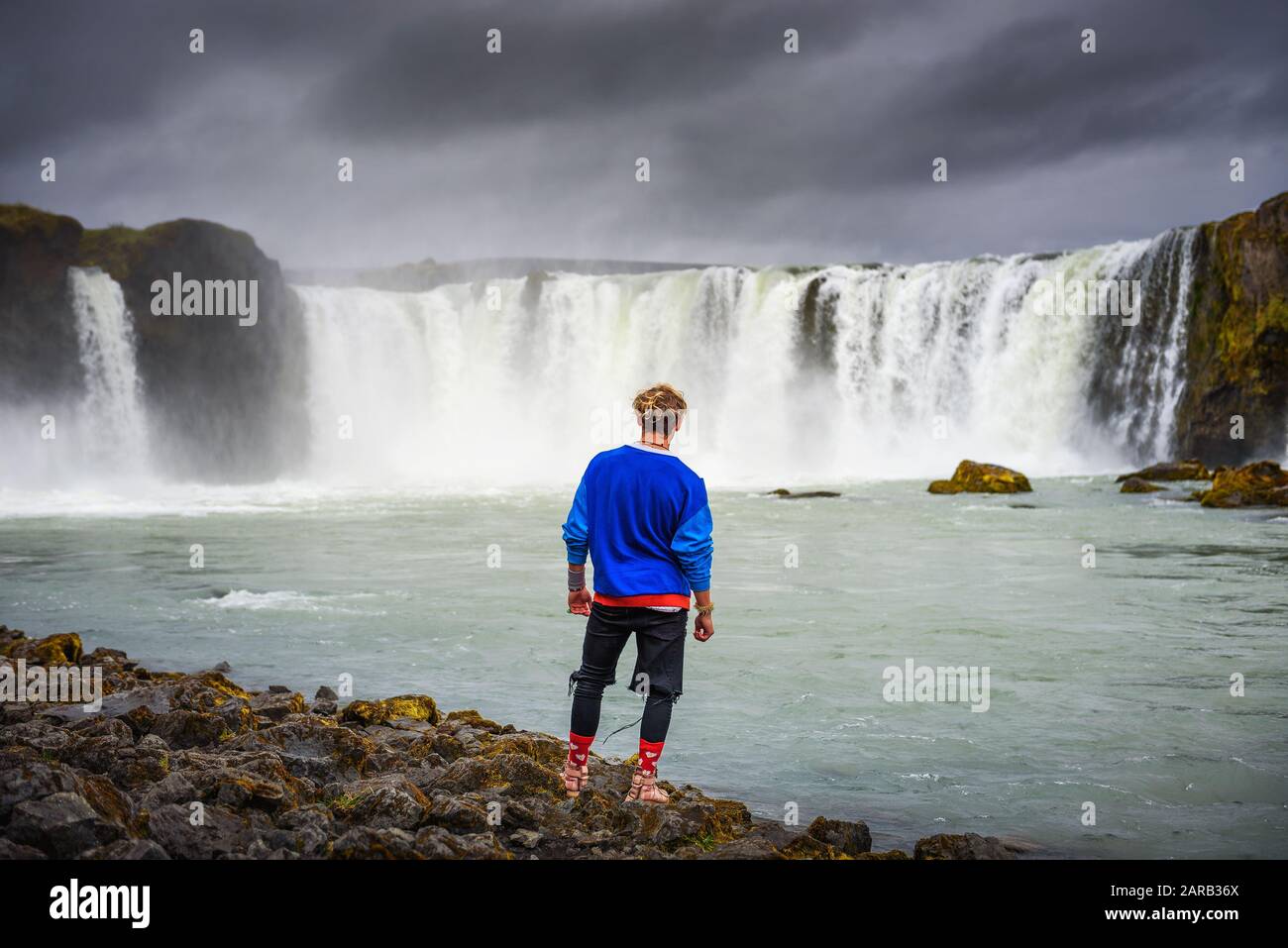 Man standing beautiful waterfall in hi-res stock photography and images ...