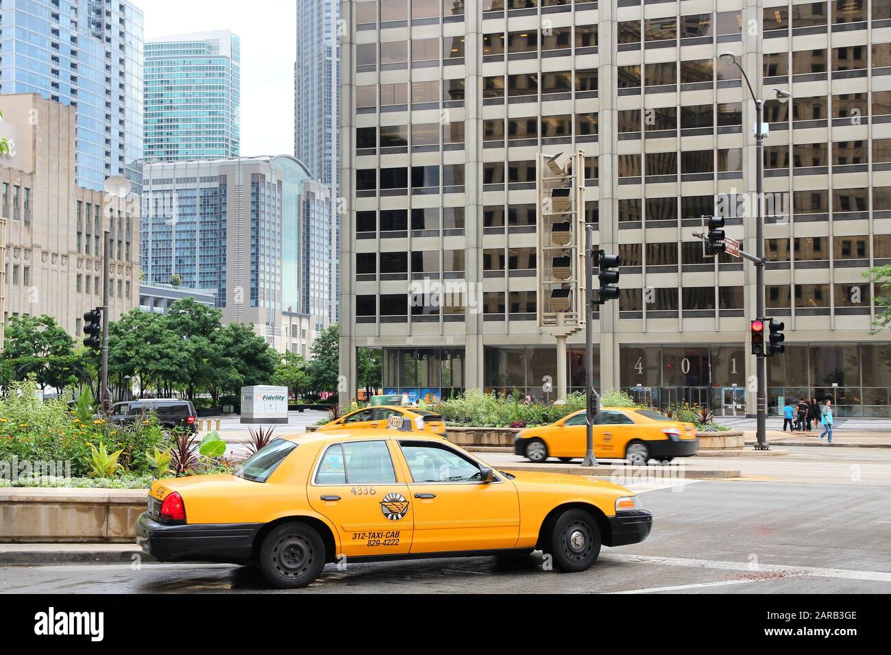 CHICAGO, USA - JUNE 26, 2013: Taxi cab drives in Chicago. Chicago is ...