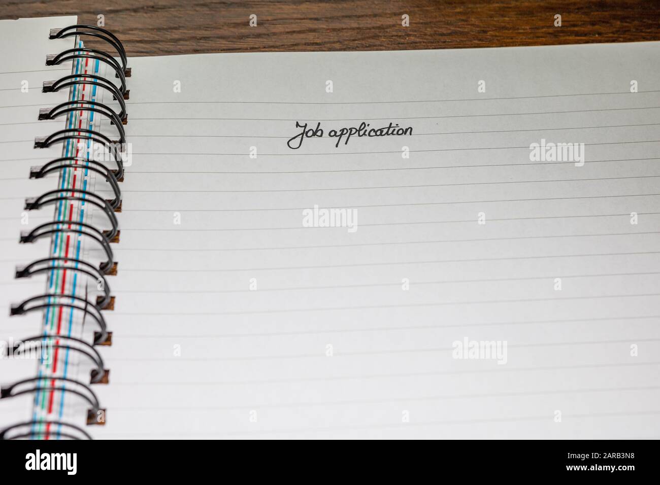 Job application, handwriting text on page of office agenda, office ...