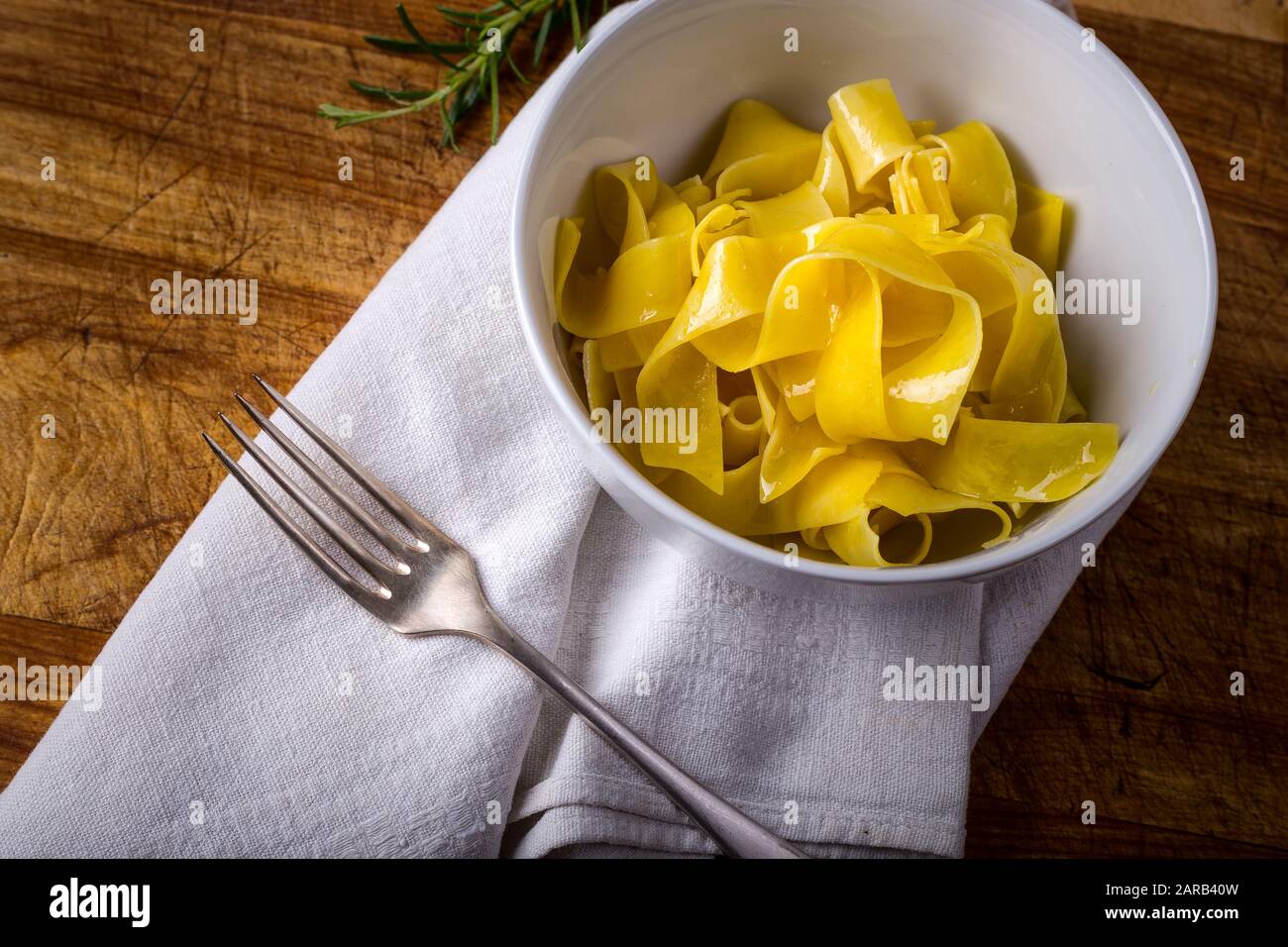 Clean traditional italian pasta with rosemary,cloth and fork Stock ...