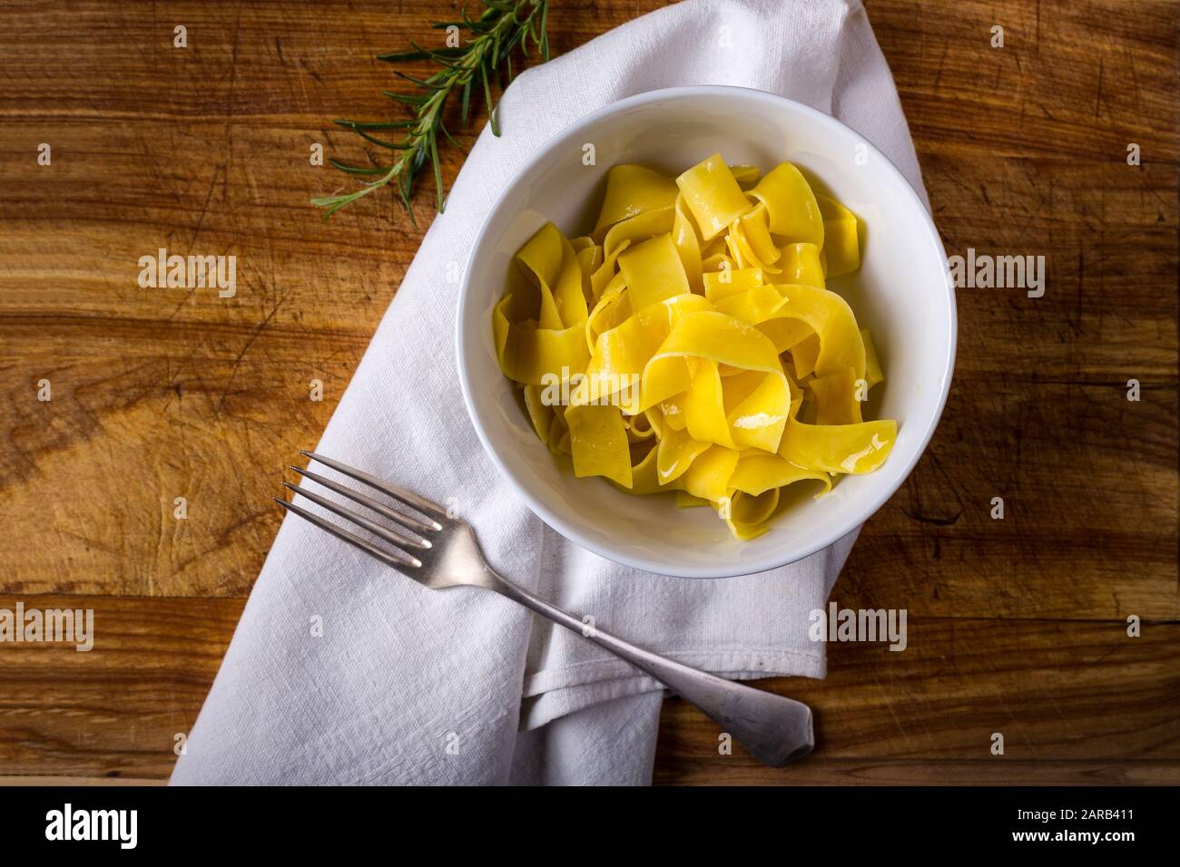 Clean traditional italian pasta with rosemary,cloth and fork Stock ...