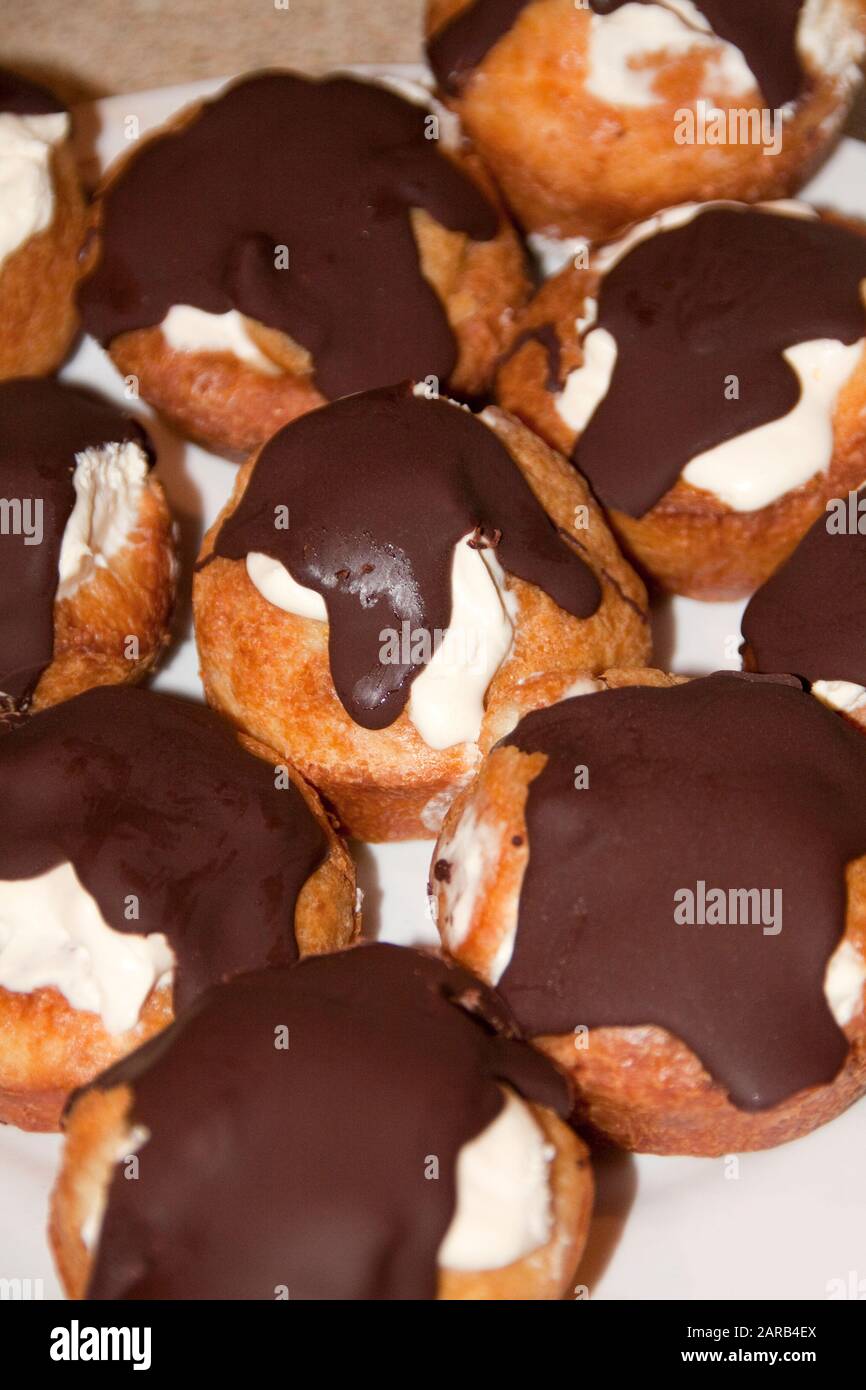 Plate chocolate profiteroles close hi-res stock photography and images ...